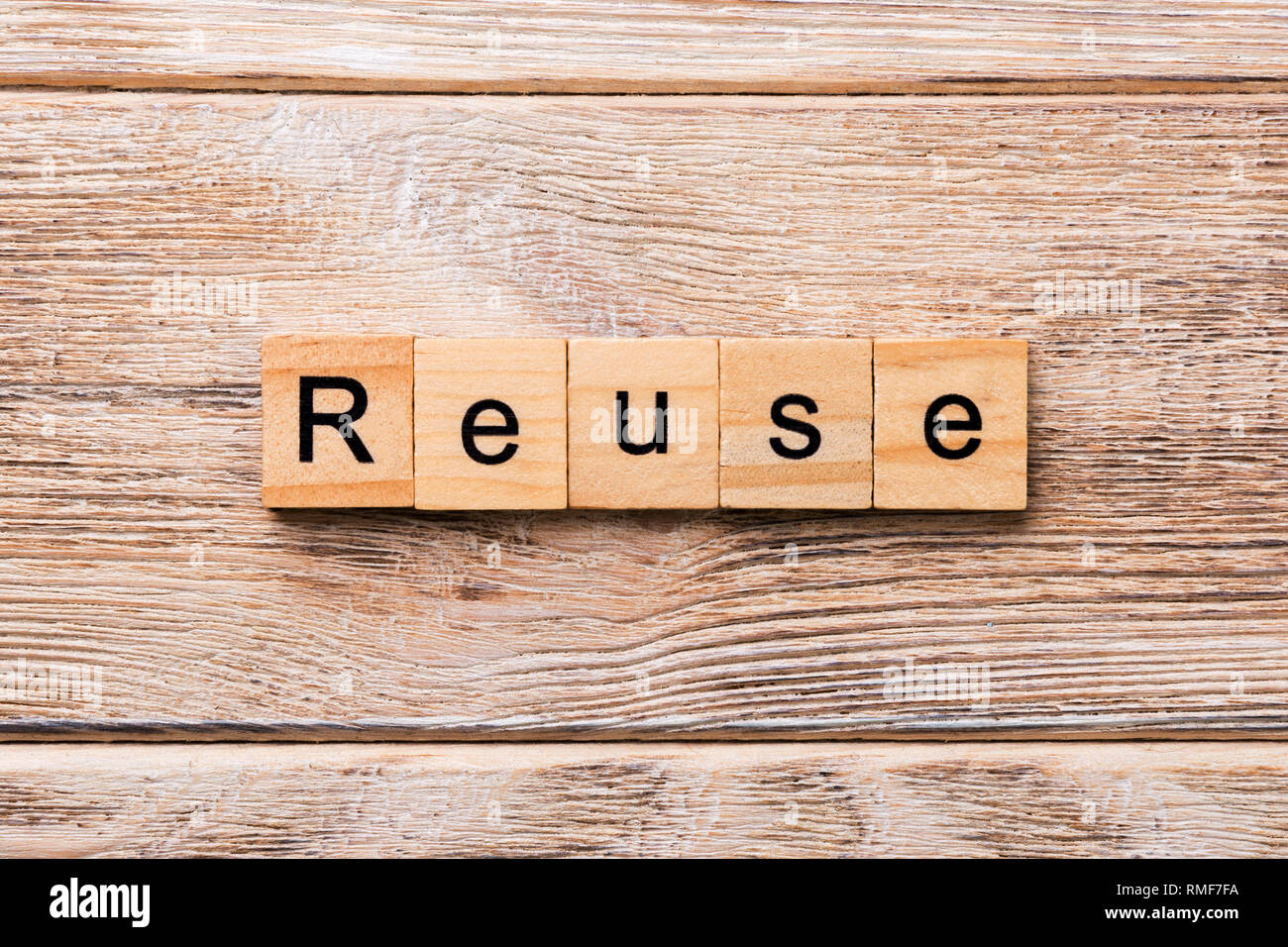 reuse word written on wood block. reuse text on wooden table for your ...