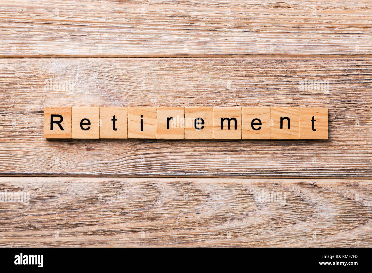 retirement word written on wood block. retirement text on wooden table ...