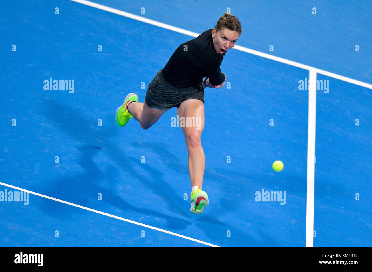 Doha, Qatar. 14th Feb, 2019. Simona Halep of Romania hits a return ...