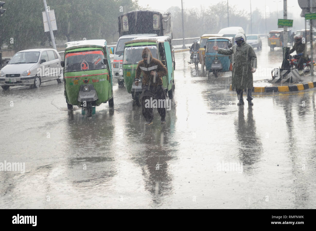 People and motorist on their way during fresh spell of heavy rain fall ...