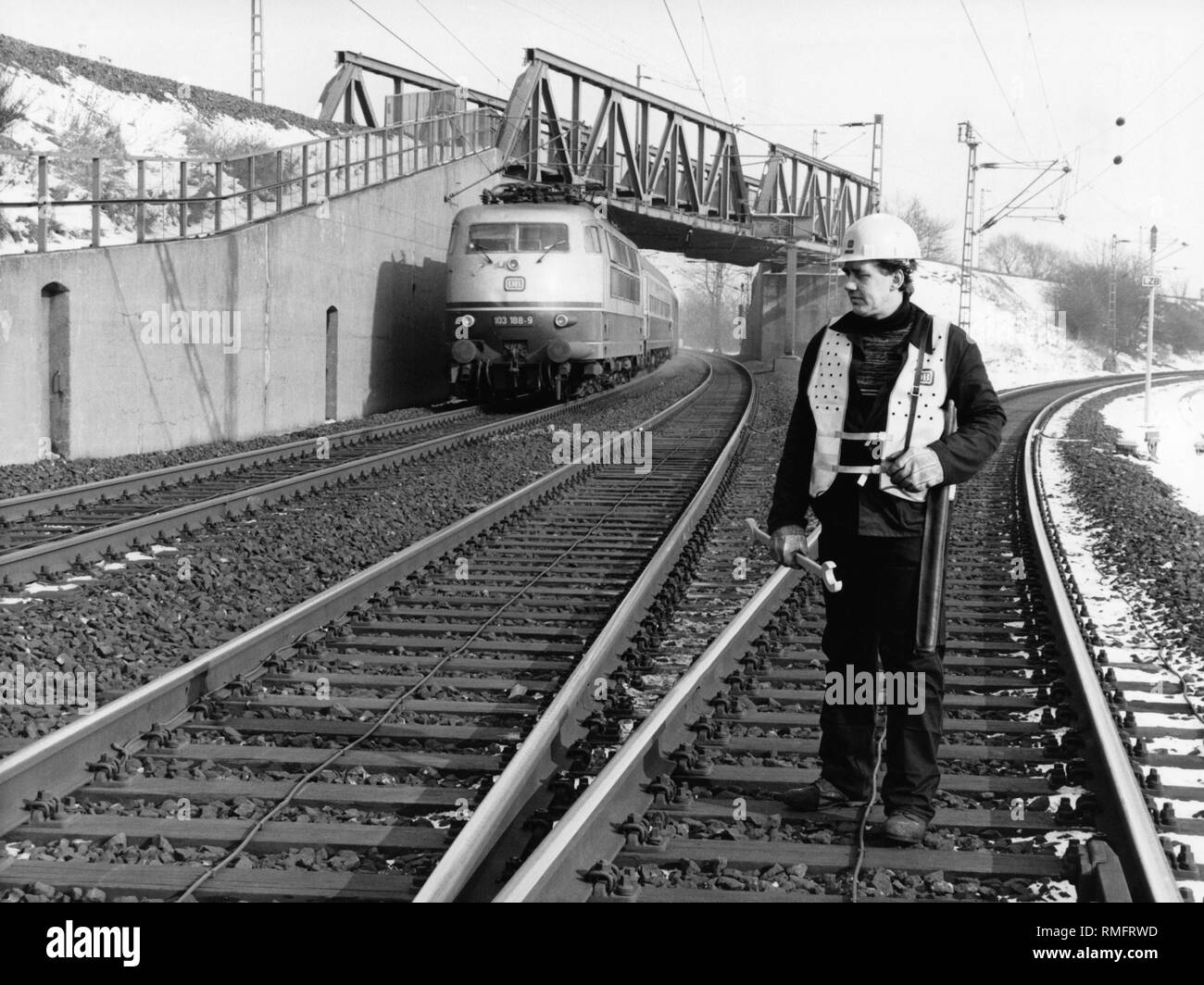 A track walker of the Bundesbahn at work. He checks daily several tens ...