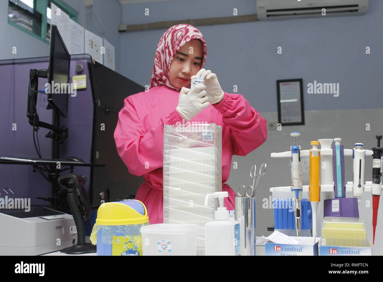 Madiun, Indonesia. 14th Feb, 2019. Officers carry out the stages of ...