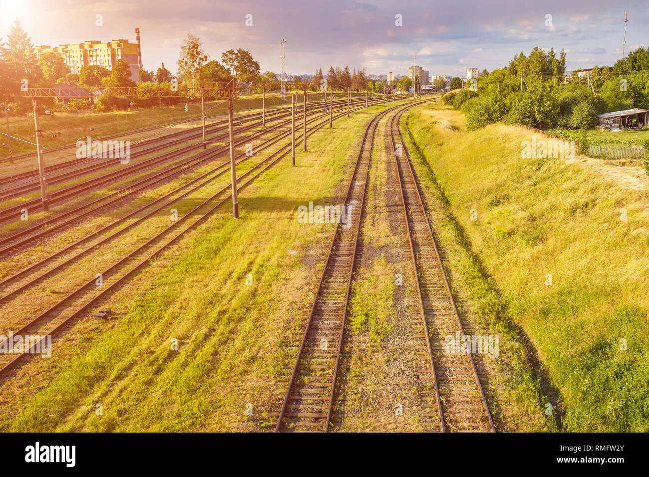 Aerial view on Railway tracks against beautiful sky at sunset. Cargo ...