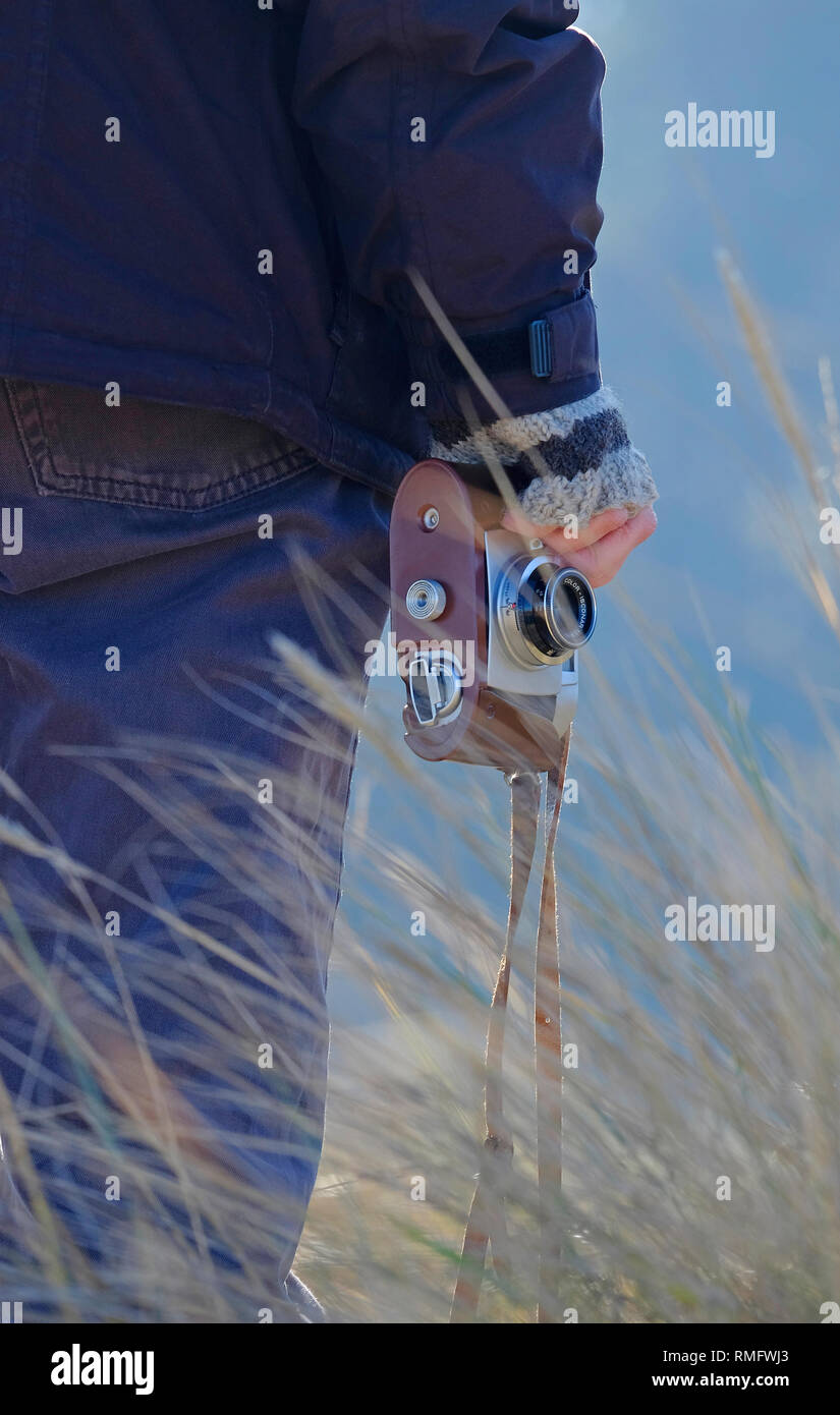 Person holding camera hi-res stock photography and images - Alamy