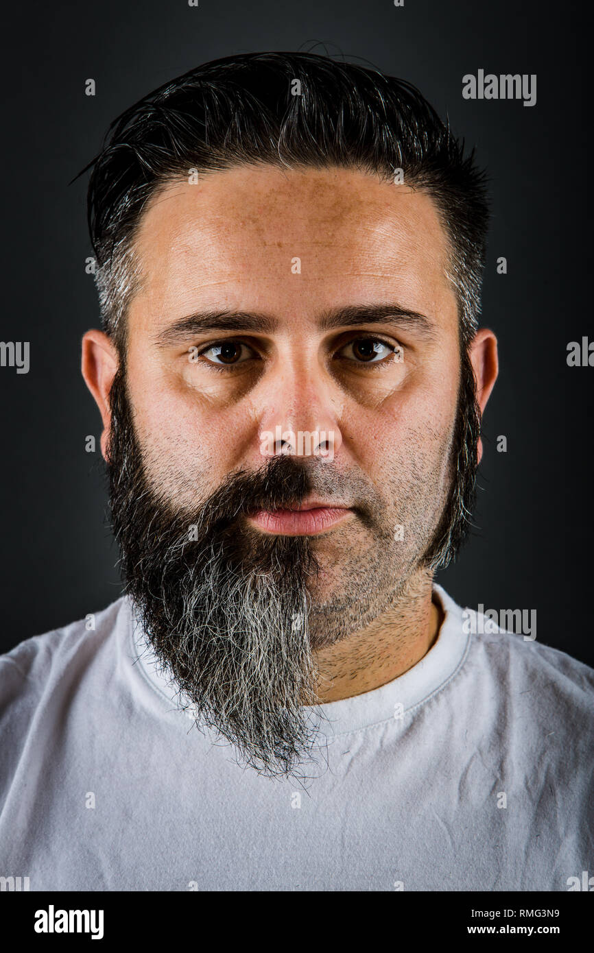 Confident man with half beard Stock Photo - Alamy
