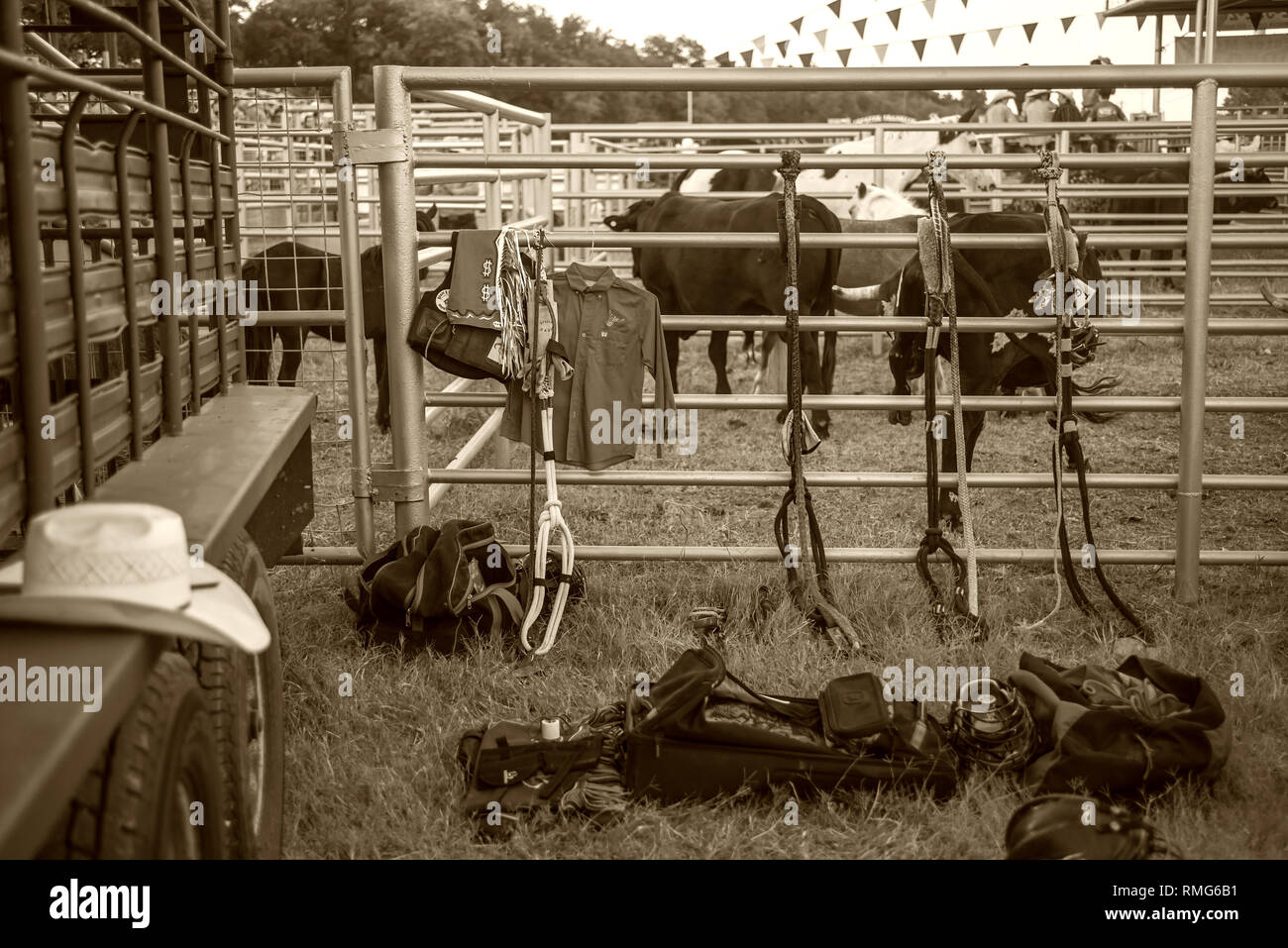 Cowboy hat and rodeo equipment on fence Stock Photo - Alamy