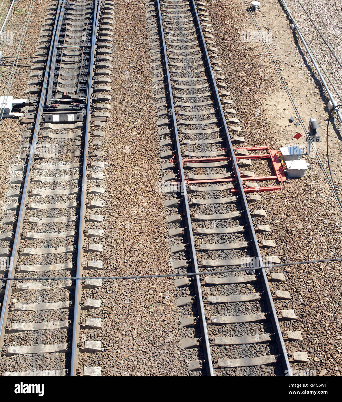 Railroad tracks on concrete sleepers, arrows and track equipment Stock ...
