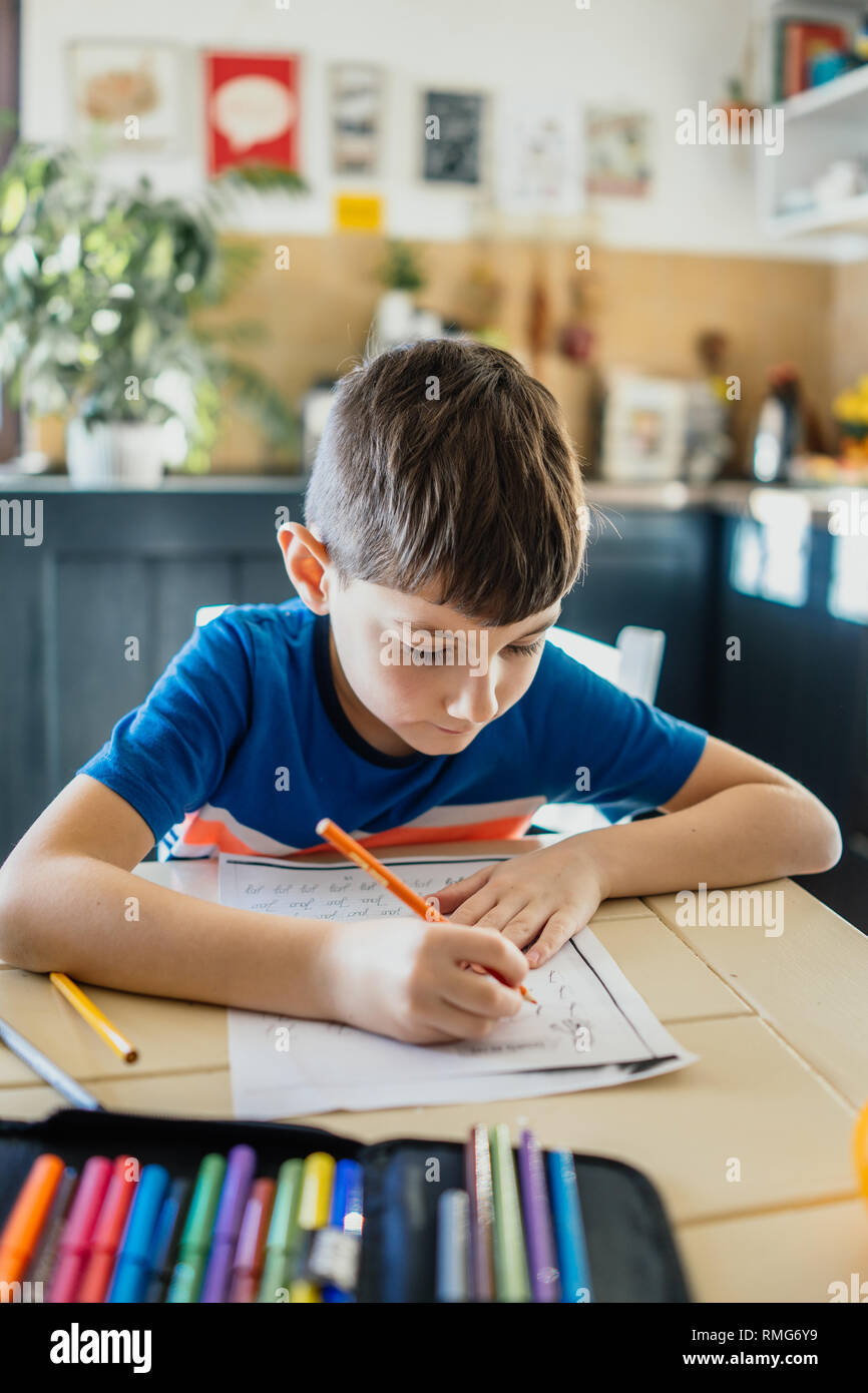 Little boy doing homework in his home Stock Photo - Alamy