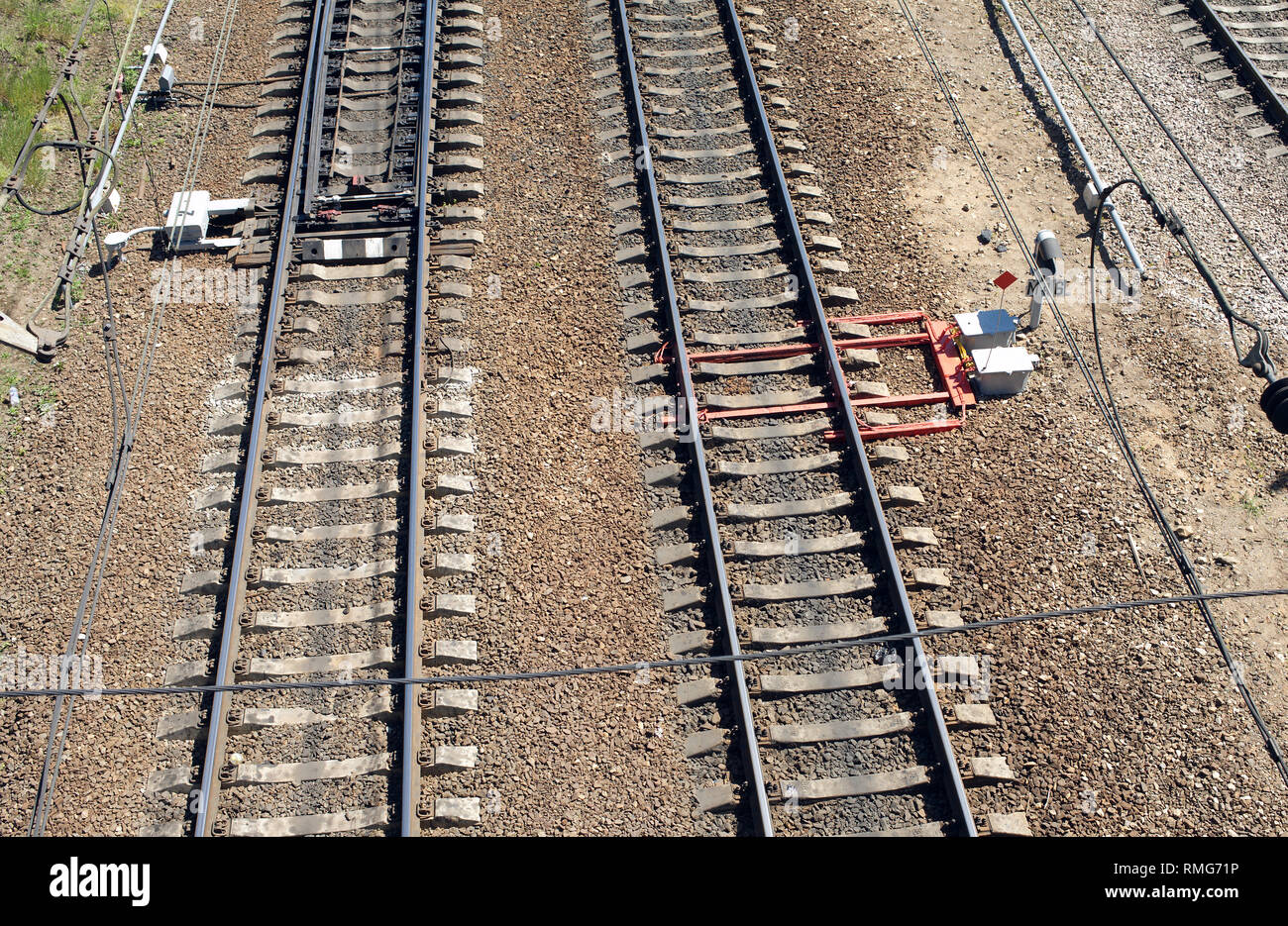 Railroad tracks on concrete sleepers, arrows and track equipment Stock ...