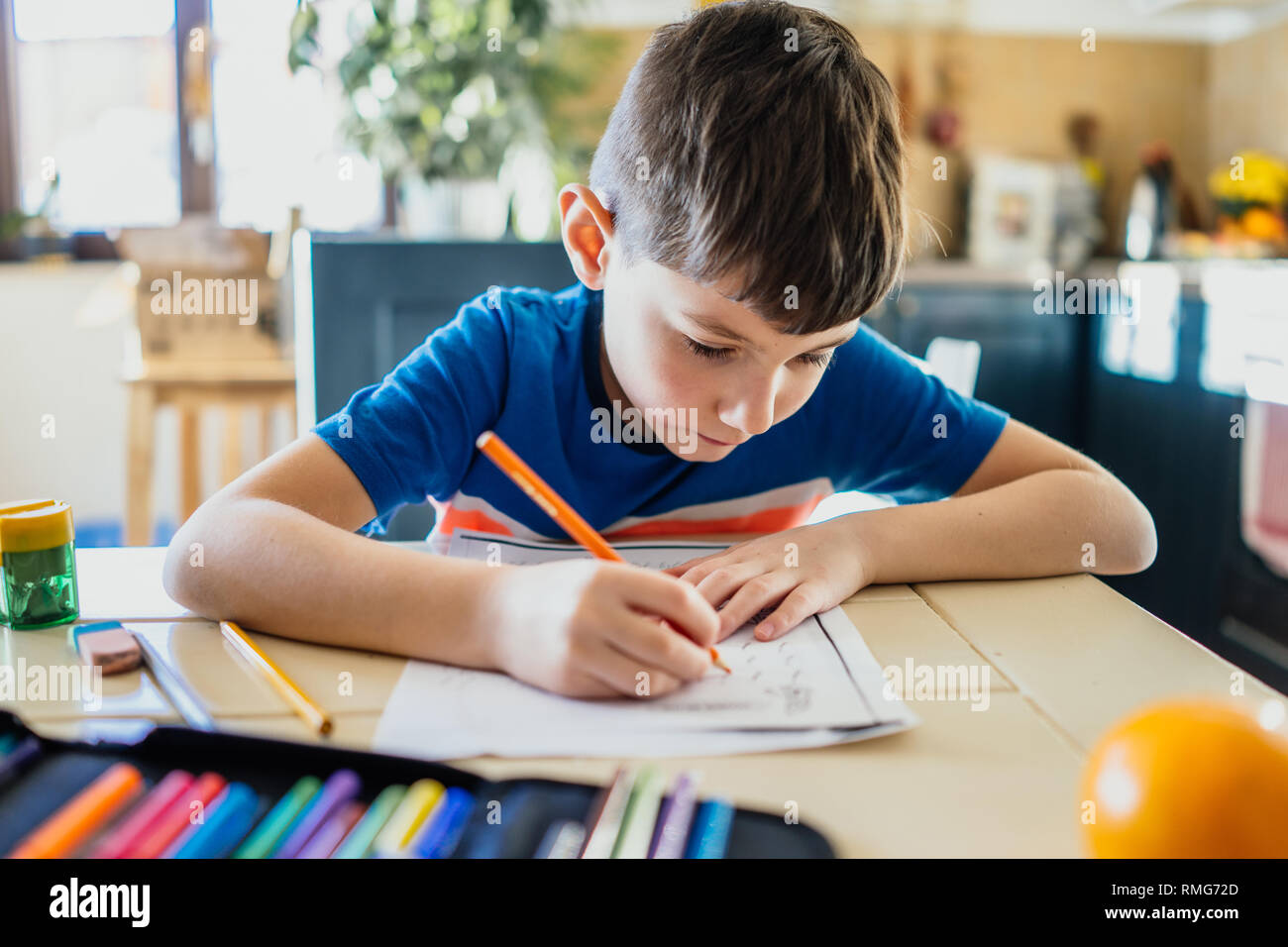 Little boy doing homework in his home Stock Photo - Alamy