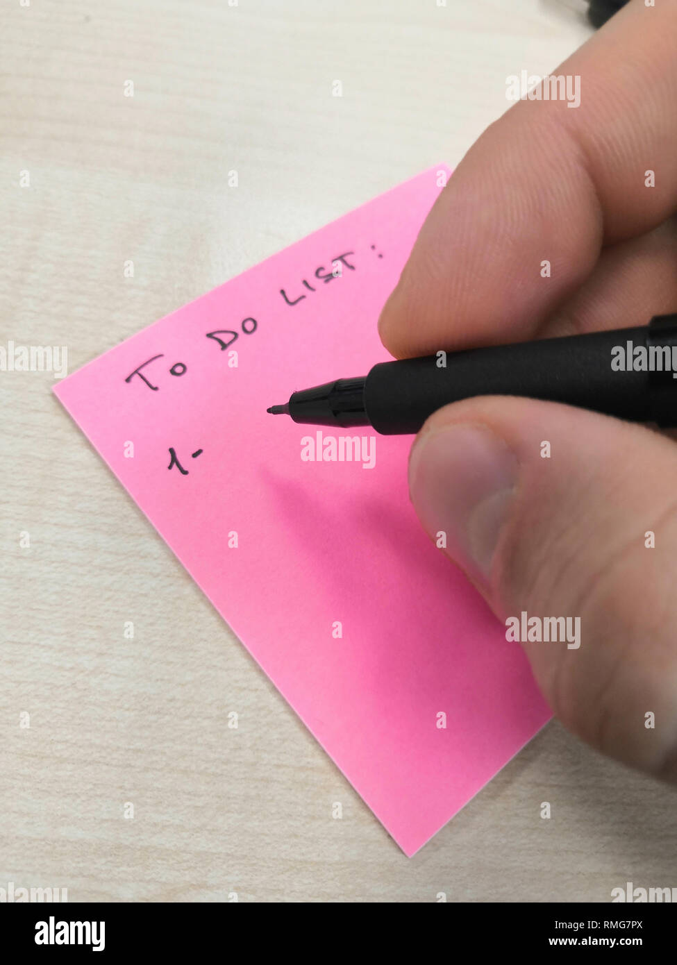 hand writing with pen on a sheet of paper post-it Stock Photo - Alamy