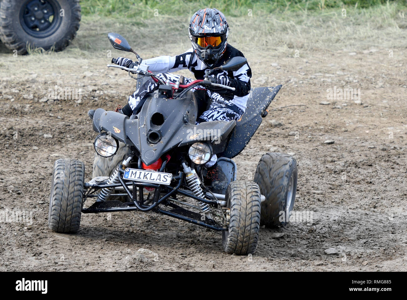A young boy riding a quad/ATV offroad Stock Photo - Alamy