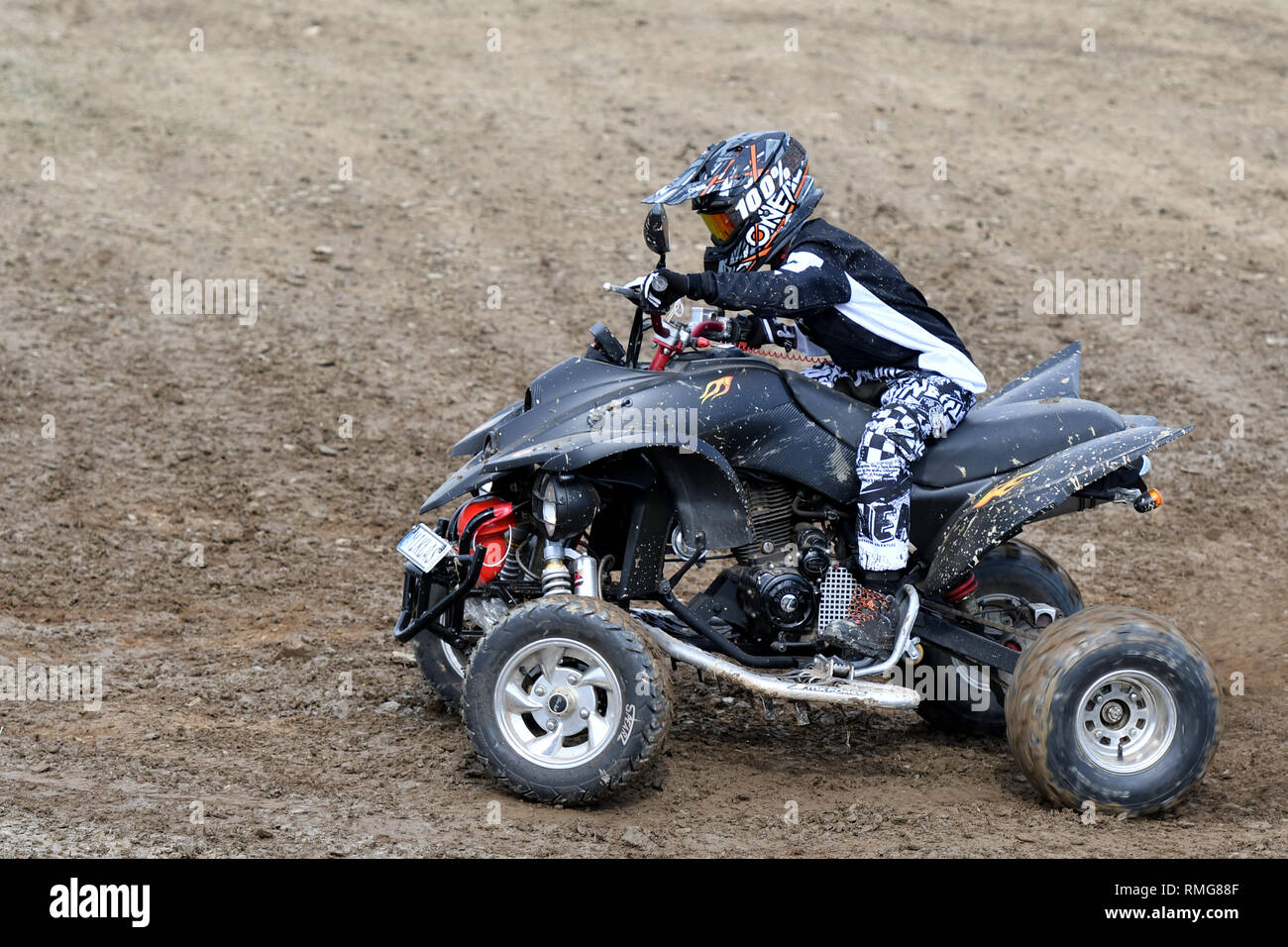 A young boy riding a quad/ATV offroad Stock Photo - Alamy