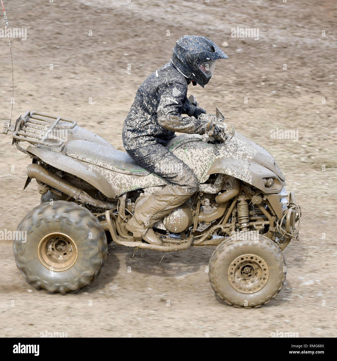 A man riding a quad/ATV offroad Stock Photo - Alamy