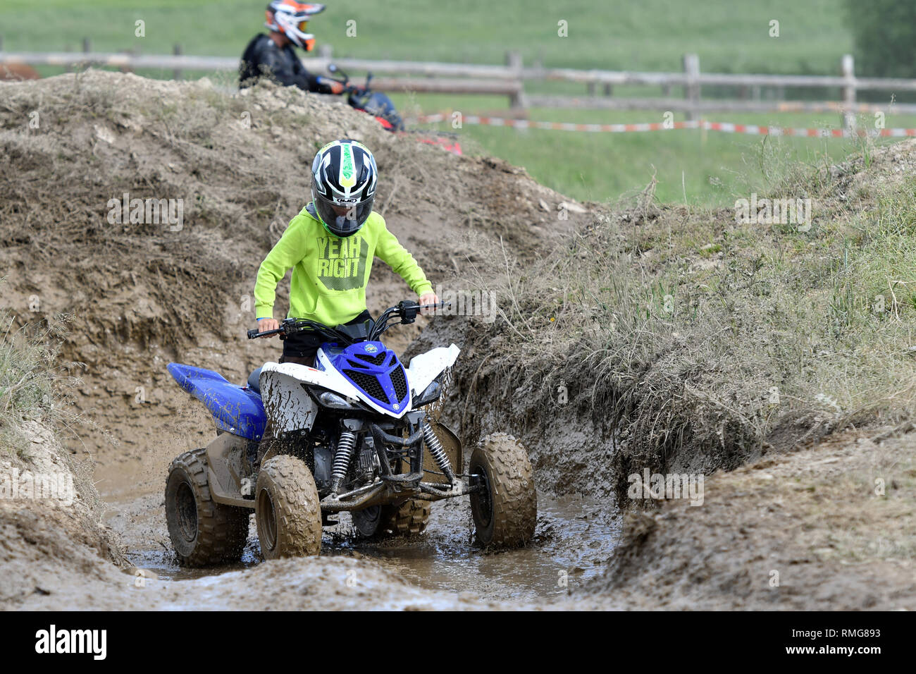 A young boy riding a quad/ATV offroad Stock Photo - Alamy