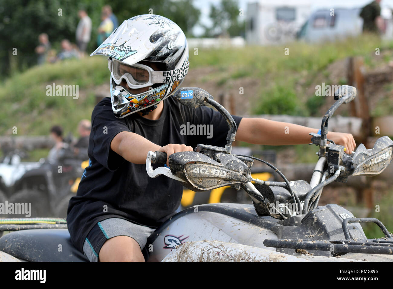 A young boy riding a quad/ATV offroad Stock Photo - Alamy