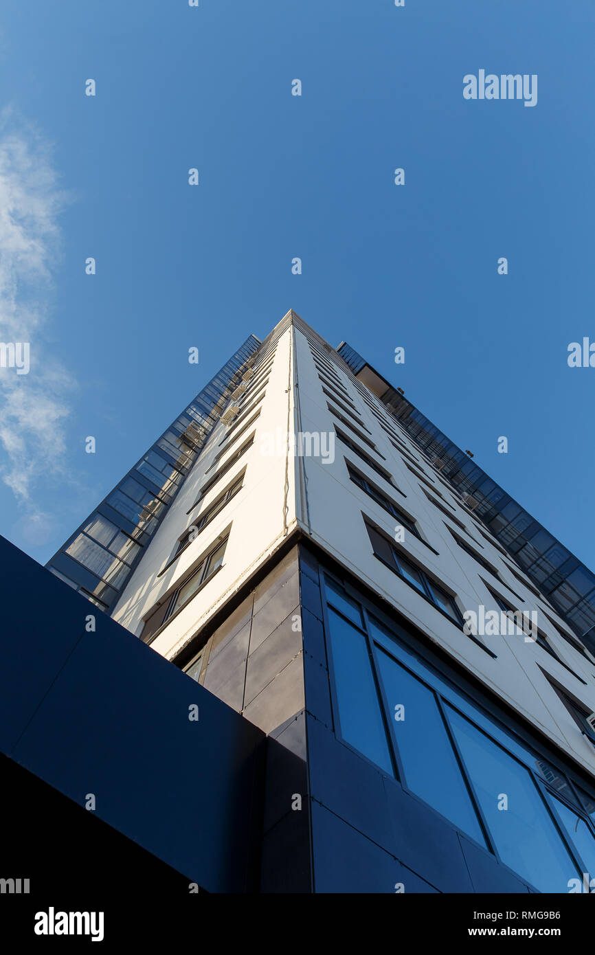 High residential building against a clear sky. Bottom view Stock Photo ...