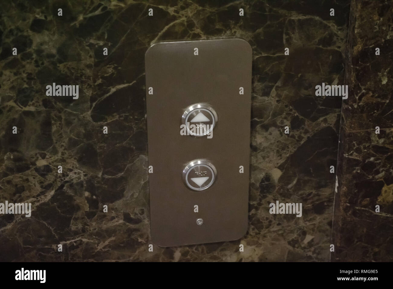 Elevator Button up and down direction, close up Stock Photo - Alamy