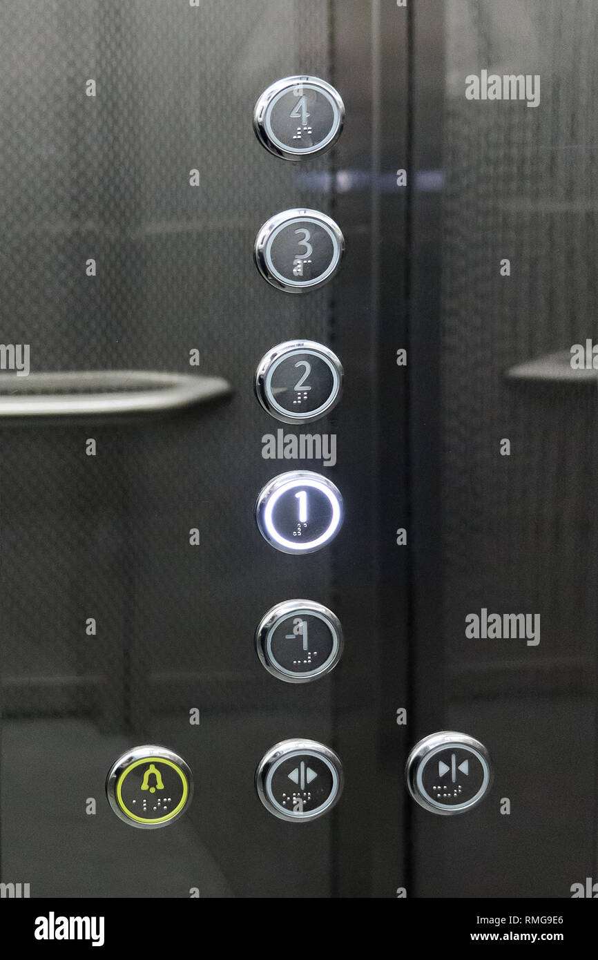 Interior and closeup of metal buttons in elevator Stock Photo - Alamy