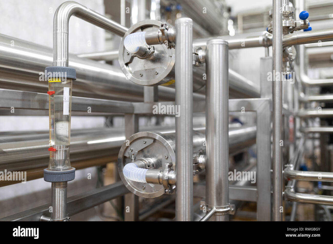Steel pipelines and cables in factory interior as industrial zone ...