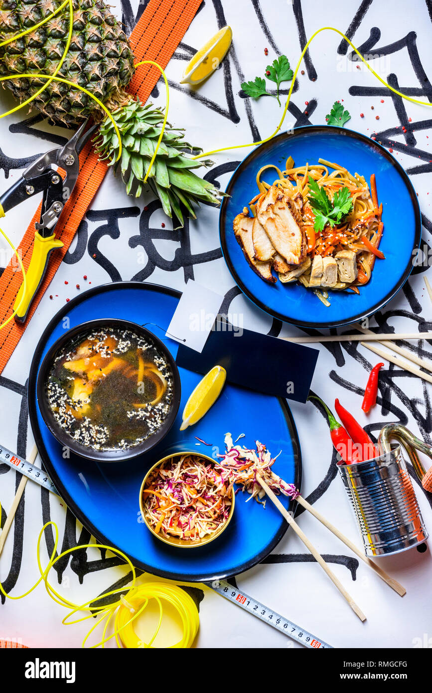 Assorted asian dinner food set. Chicken teriyaki with noodles and miso ...