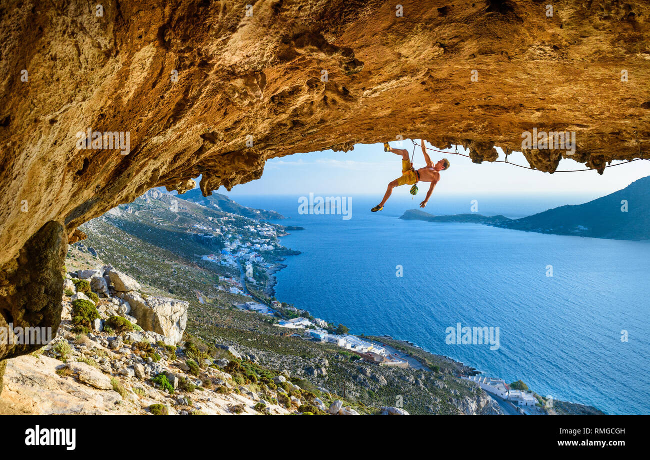 Rock climbing man. Climbing Sport fitness athlete on beautiful rocks ...