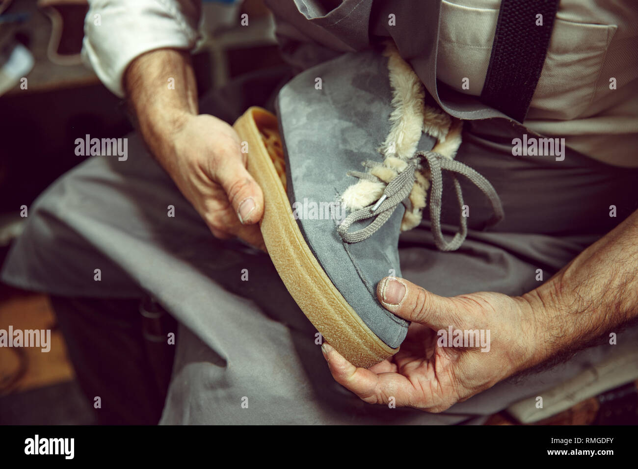 Enjoying process of creation custom made shoes. Workplace of shoe ...