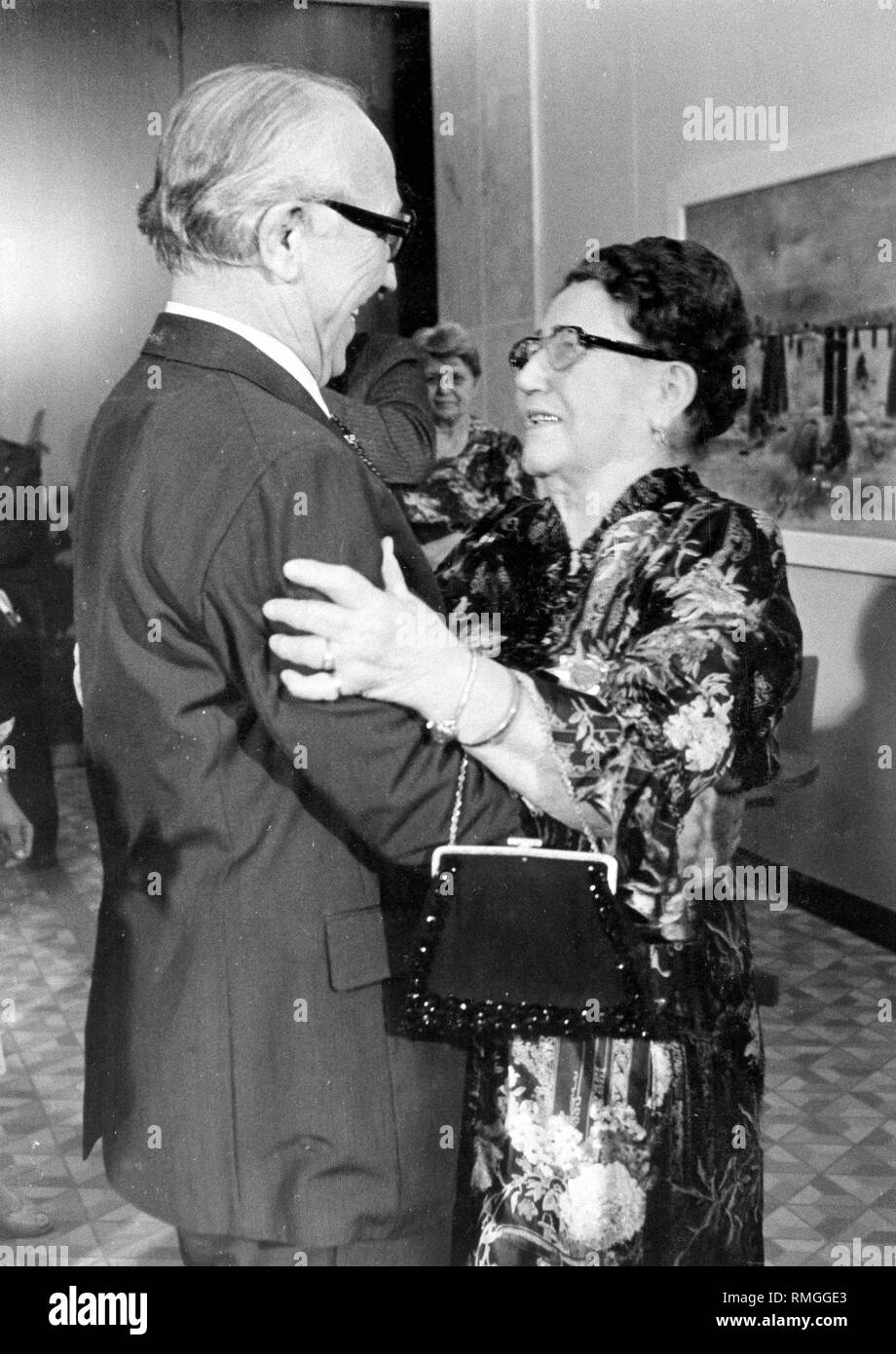 GDR People's Chamber President Horst Sindermann (SED) congratulates the ...