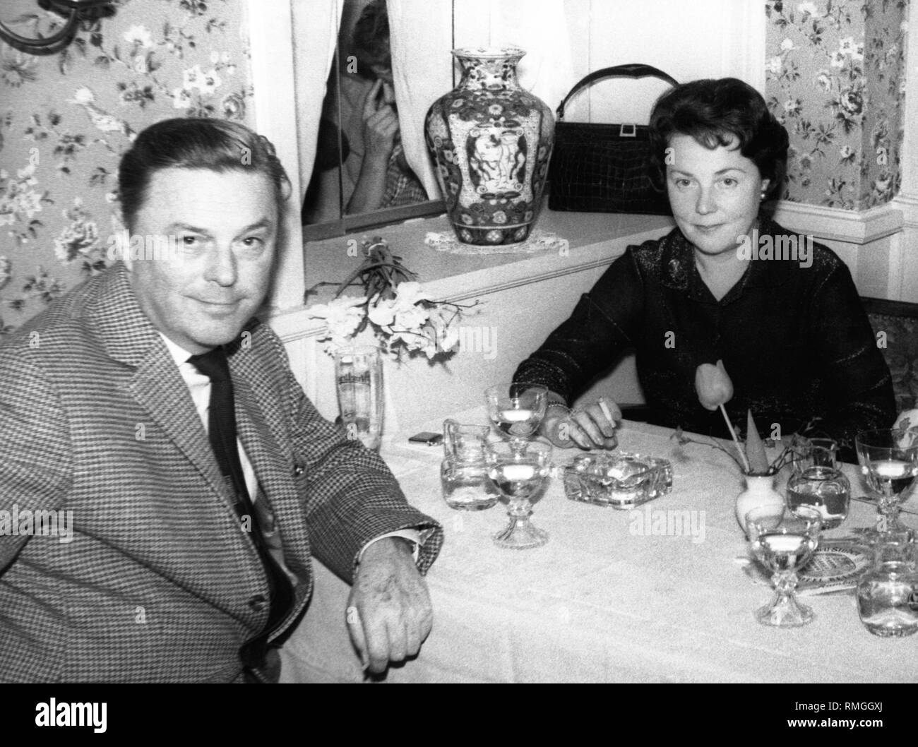 Hans Holt with his wife Renate drinking wine at a wine tavern ...