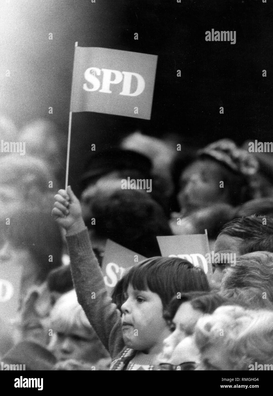 A little boy holding up an SPD banner at an SPD campaign event Stock ...