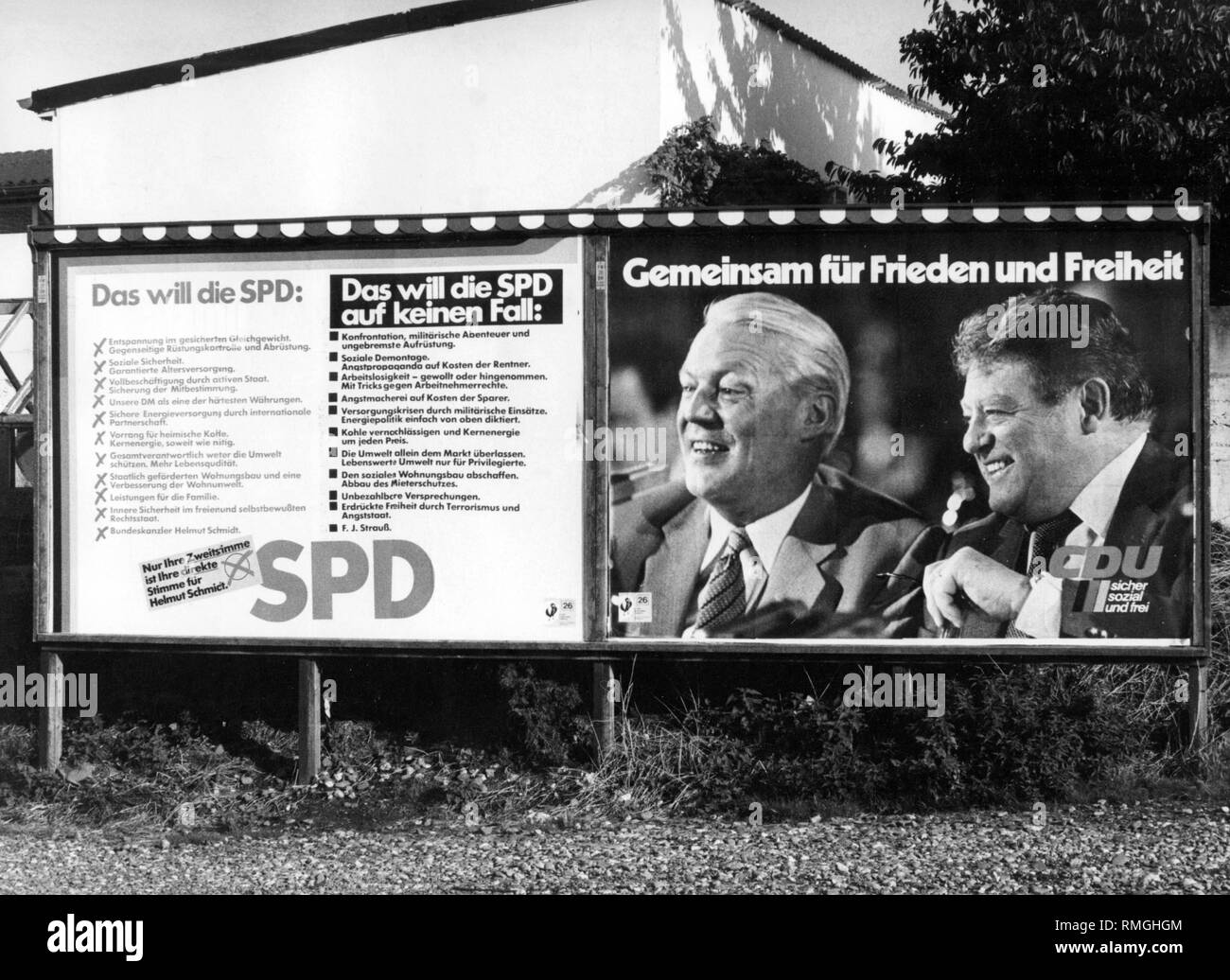 Election posters of the SPD and the CDU on a partition wall. The CDU ...