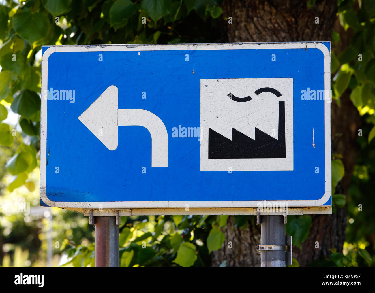 Road sign signpost with direction to an industrial area Stock Photo - Alamy