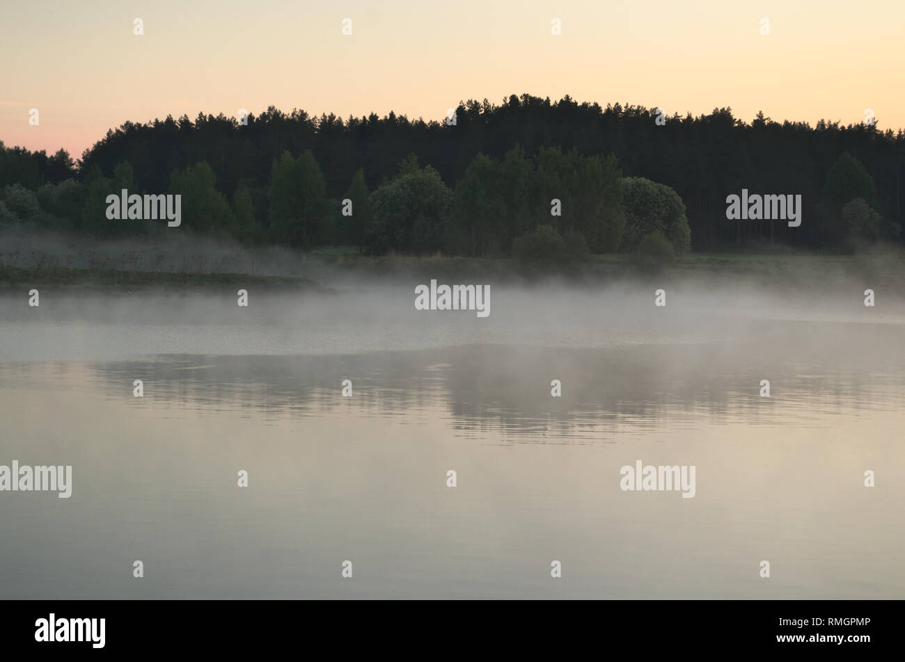 The river is covered with fog Stock Photo - Alamy