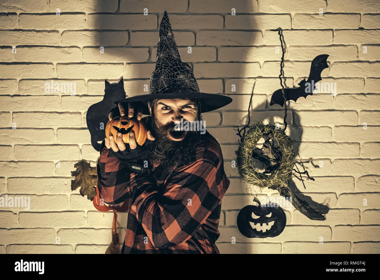 Halloween man with pumpkin in dark shadow Stock Photo - Alamy