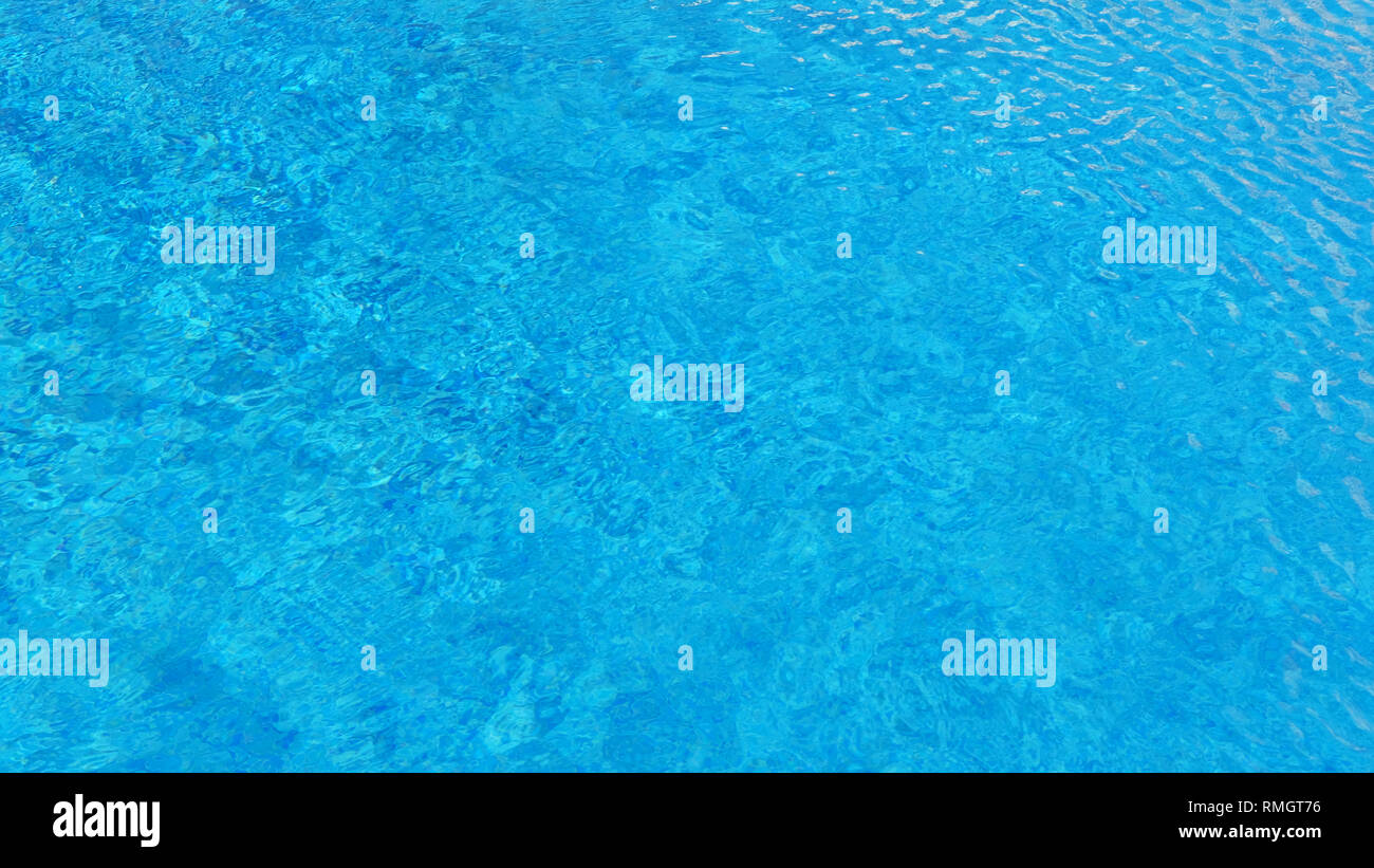 Swimming pool water background with texture of water surface with ...