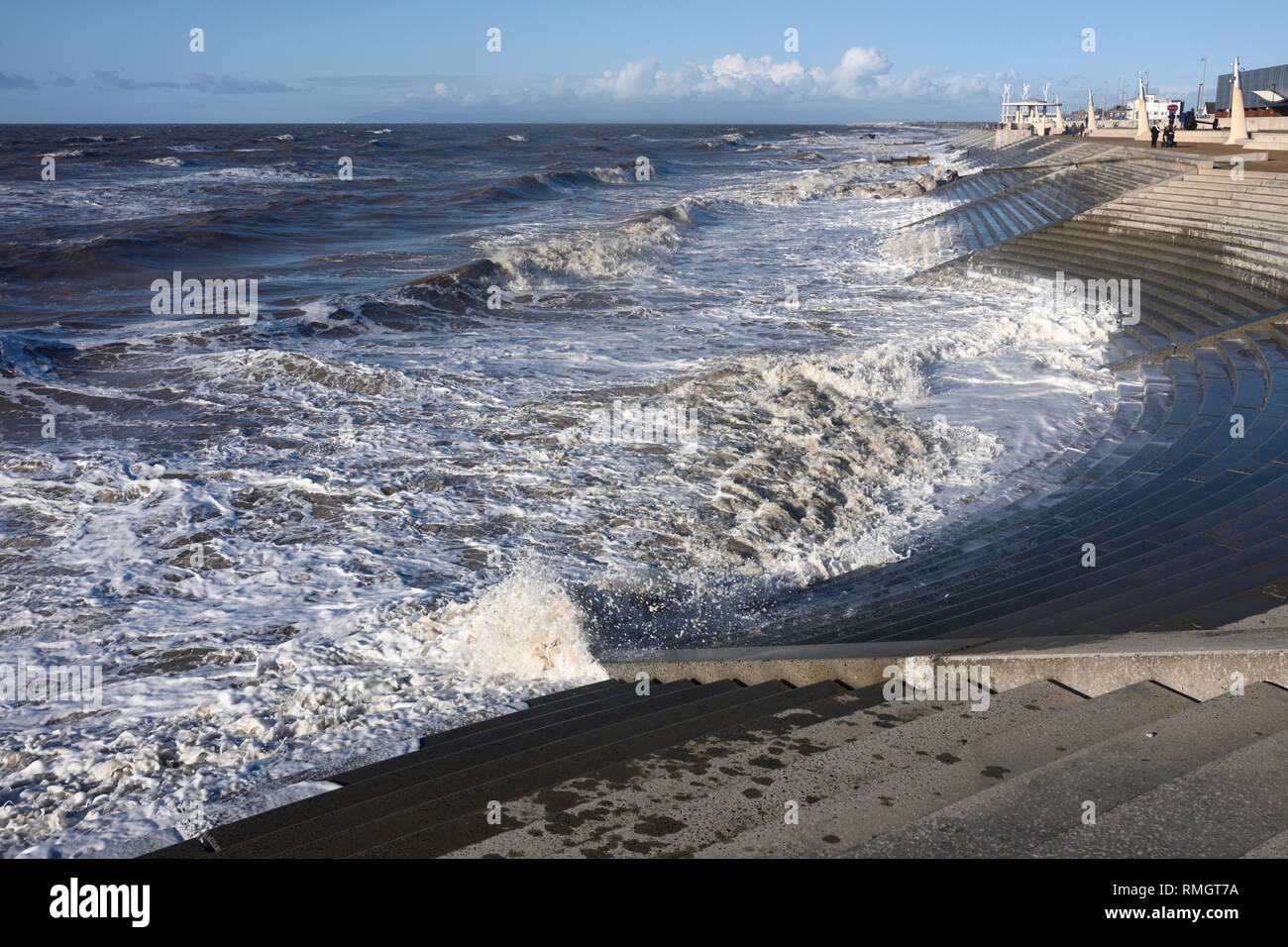 Waves from rough sea breaking on concrete stepped revetmet, protecting ...
