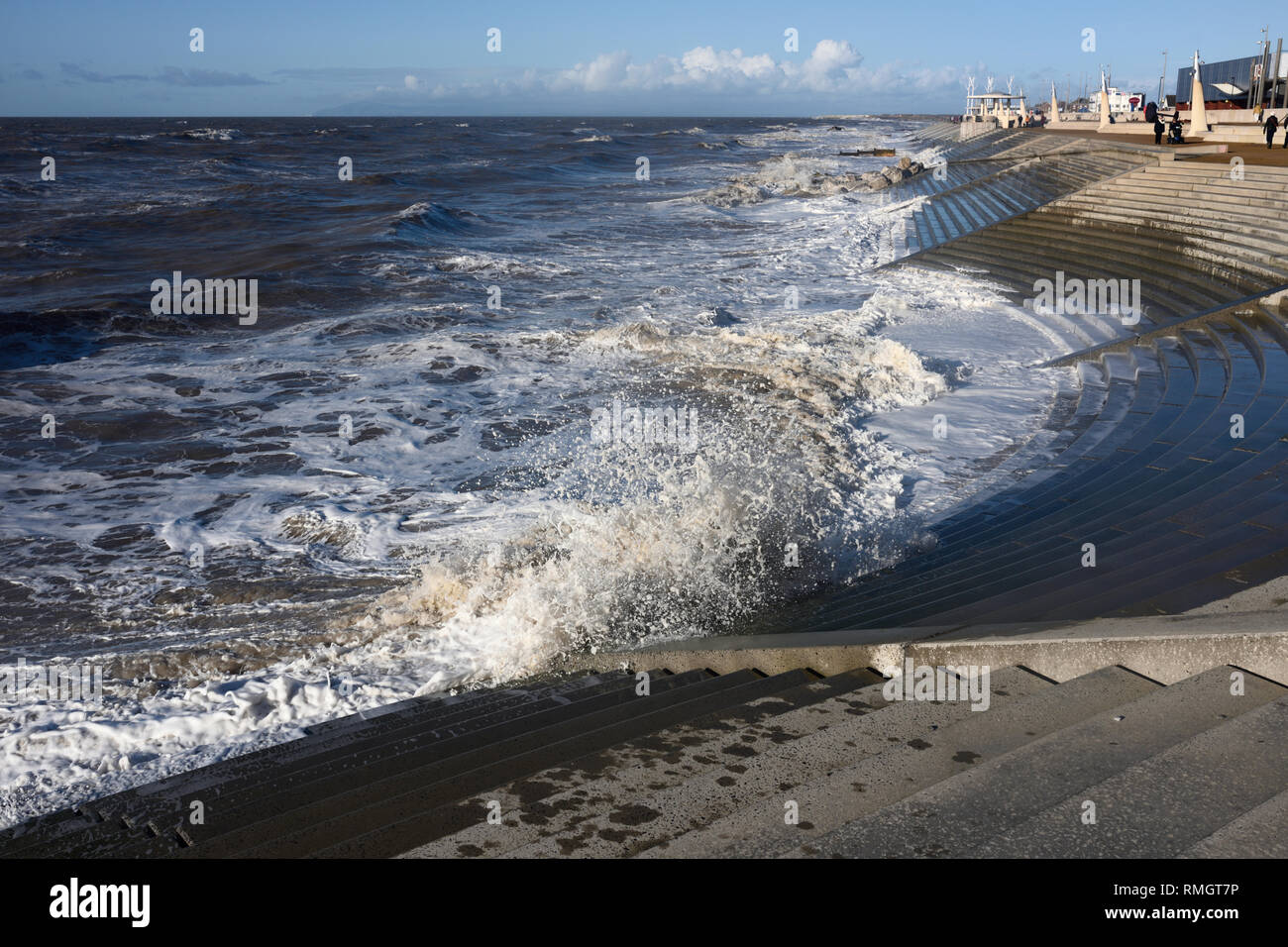 Waves from rough sea breaking on concrete stepped revetmet, protecting ...