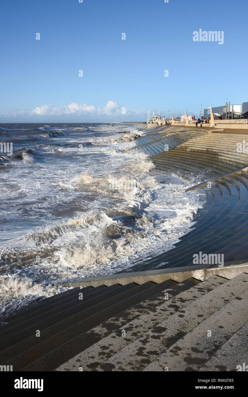 Waves from rough sea breaking on concrete stepped revetmet, protecting ...