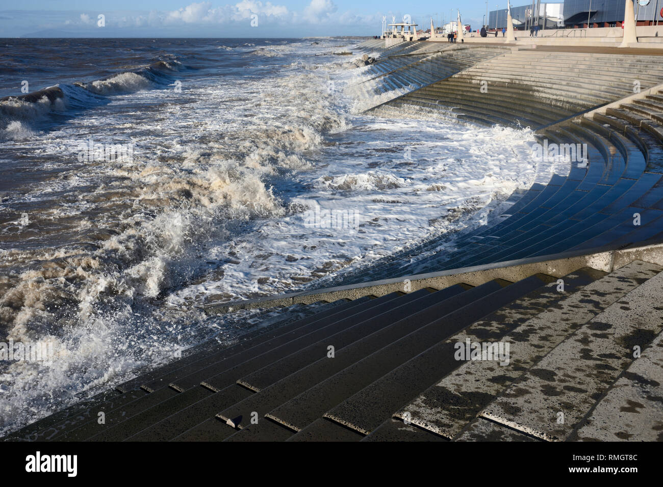 Waves from rough sea breaking on concrete stepped revetmet, protecting ...