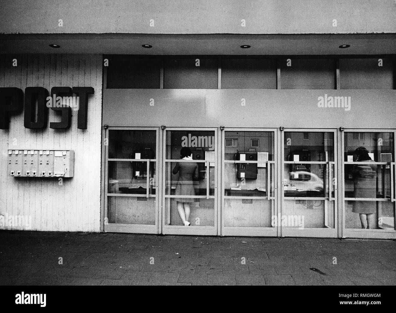 Telephone box and mailboxes of a post office Stock Photo - Alamy