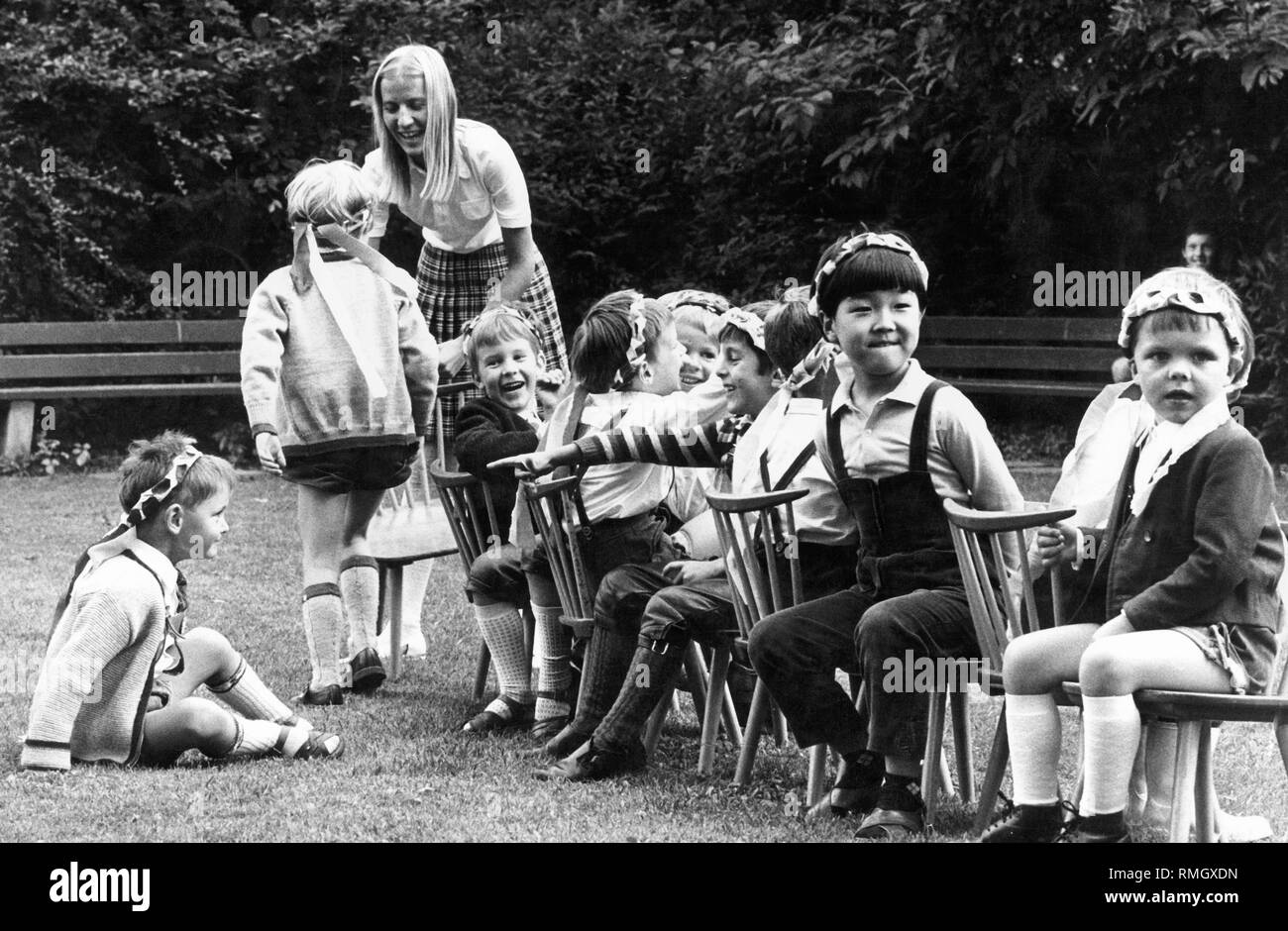 Children and teacher playing Black and White Stock Photos & Images - Alamy