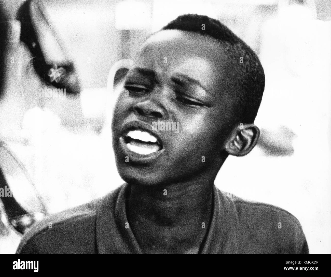 An african Kwela musician is singing in front of a shoe store. (undated ...