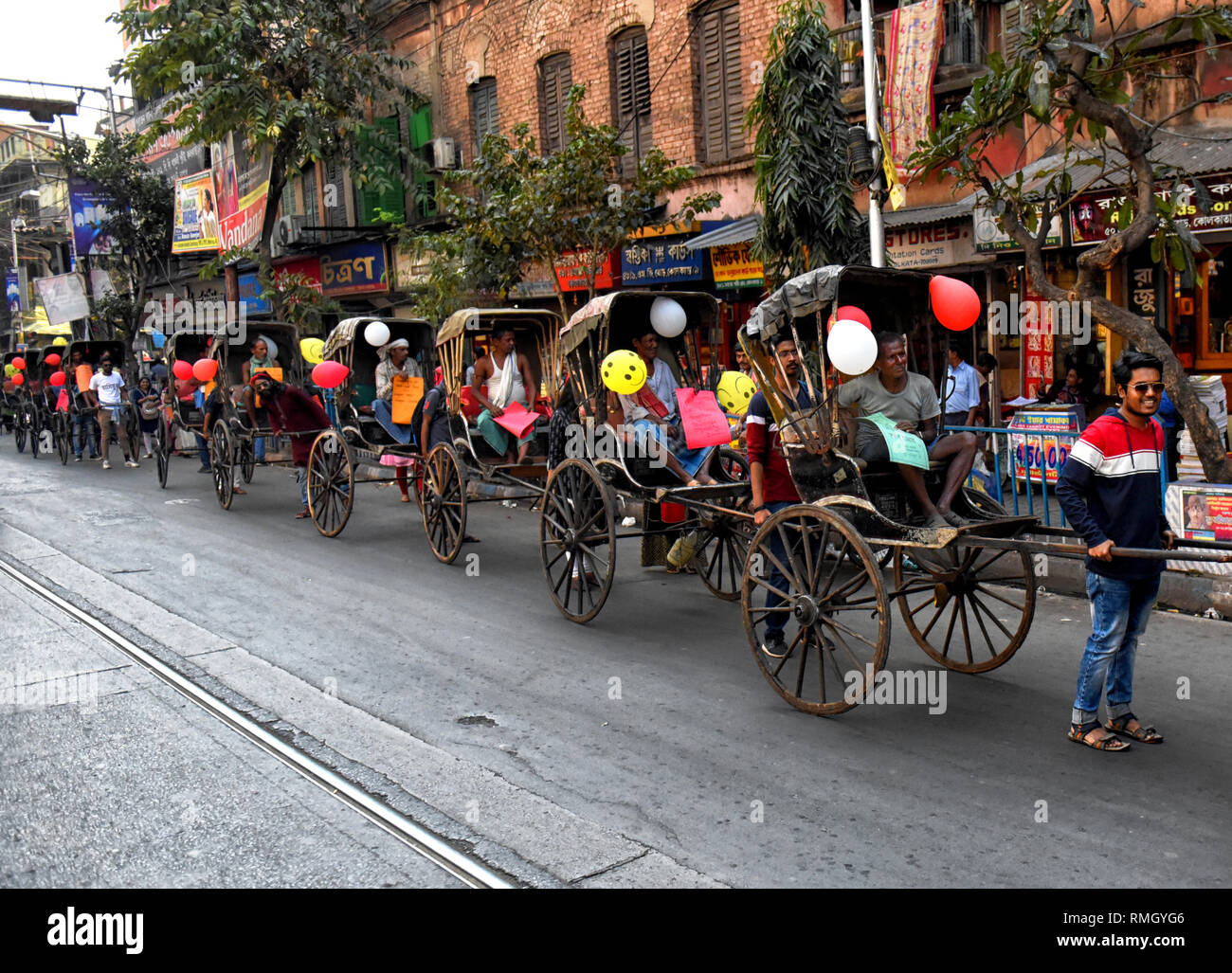 Hand Rickshaws seen along with their drivers on Valentines day. Woman ...