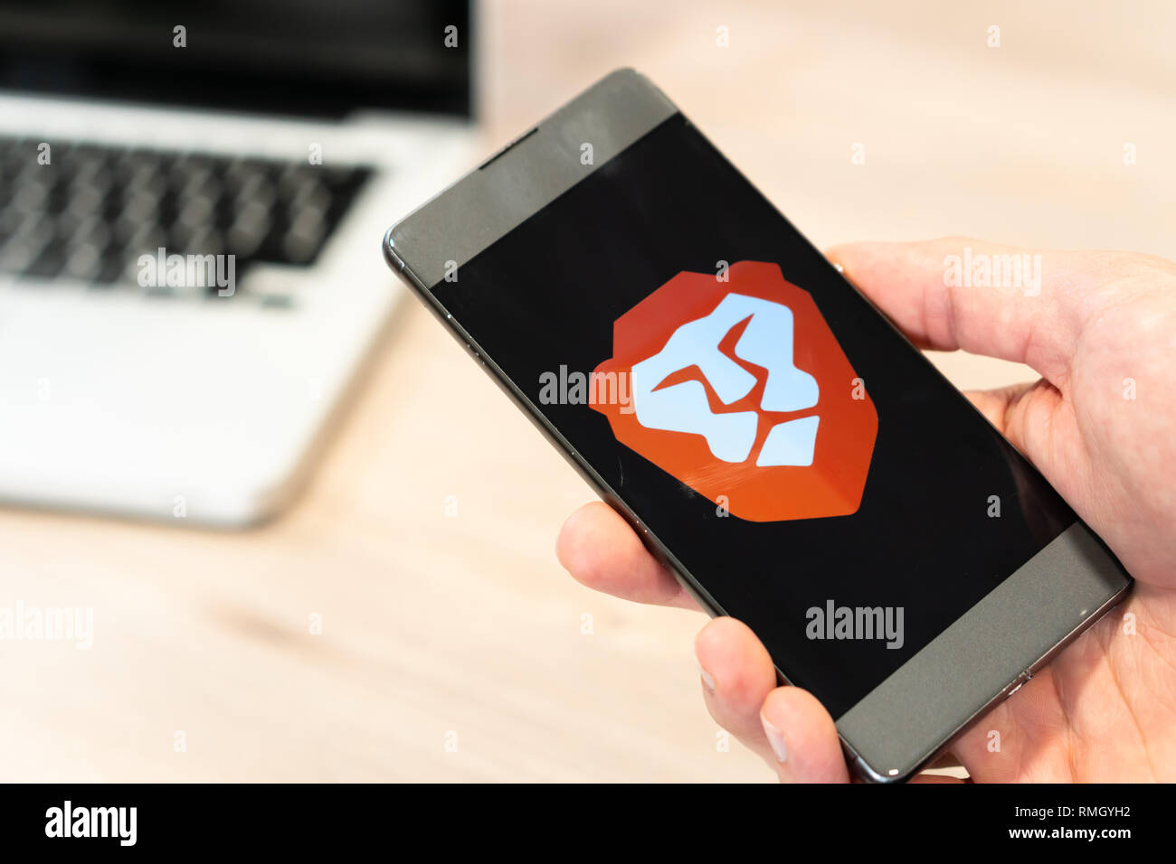 Brave Browser logo displayed on smartphone and computer laptop in ...