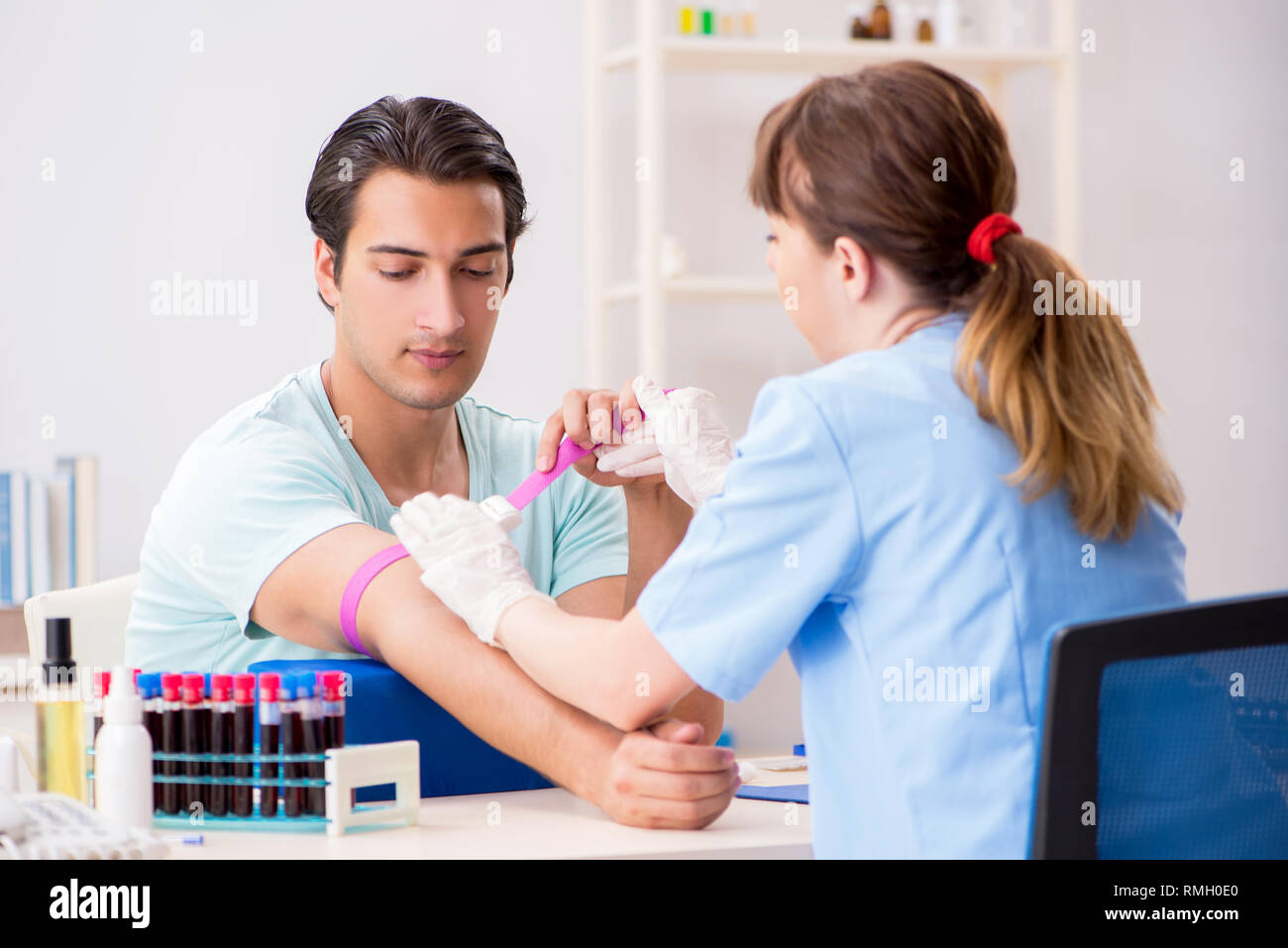 Young patient during blood test procedure Stock Photo - Alamy