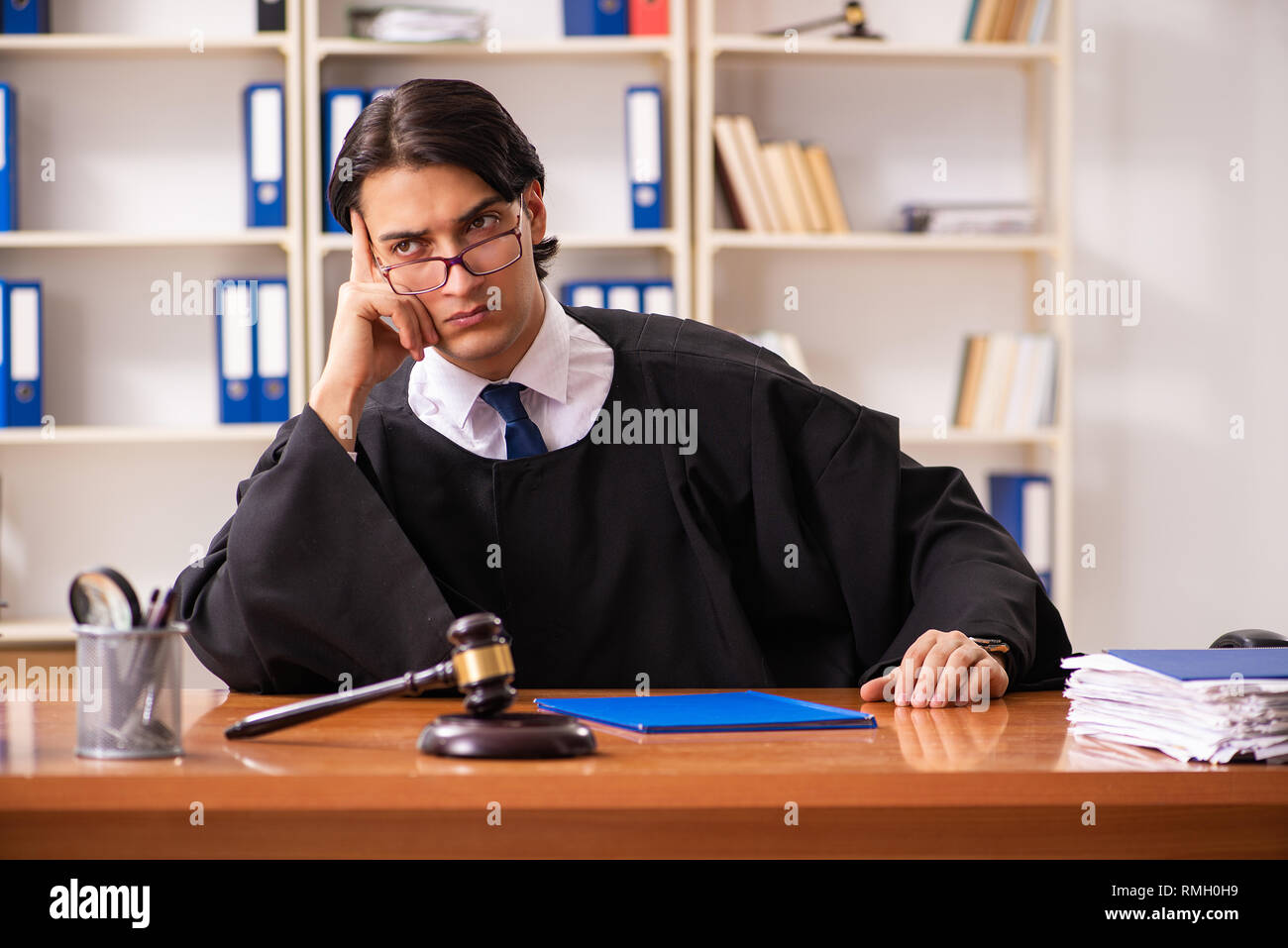 Young handsome judge working in court Stock Photo - Alamy