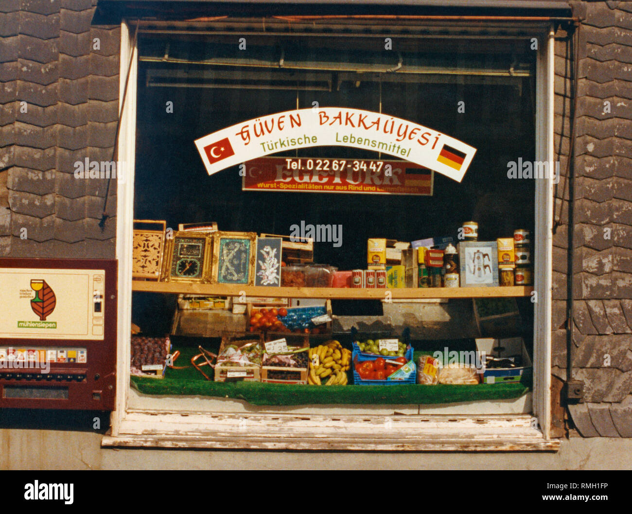 The shop window of a Turkish grocery shop with fruits and other ...