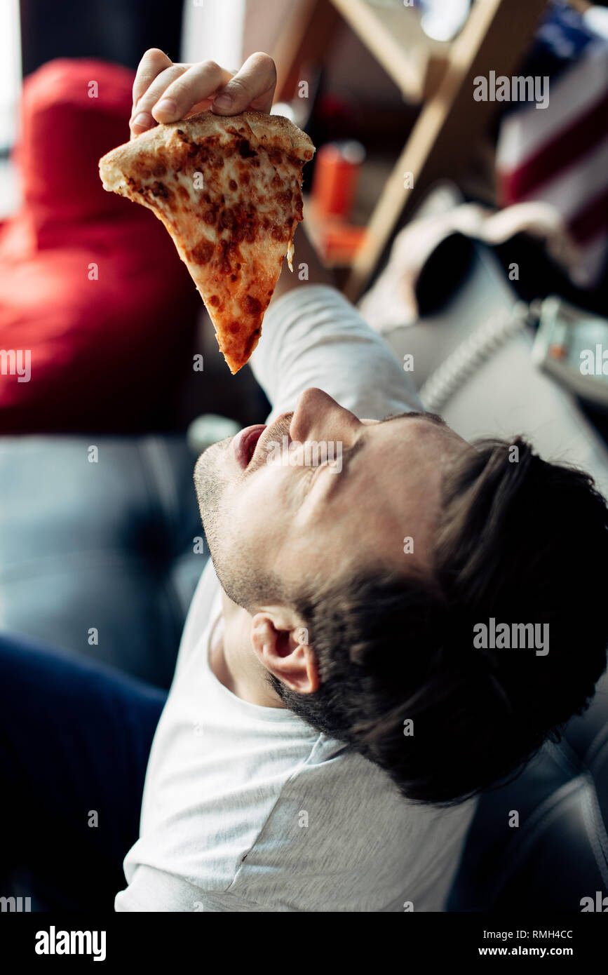 Putting into mouth hi-res stock photography and images - Alamy
