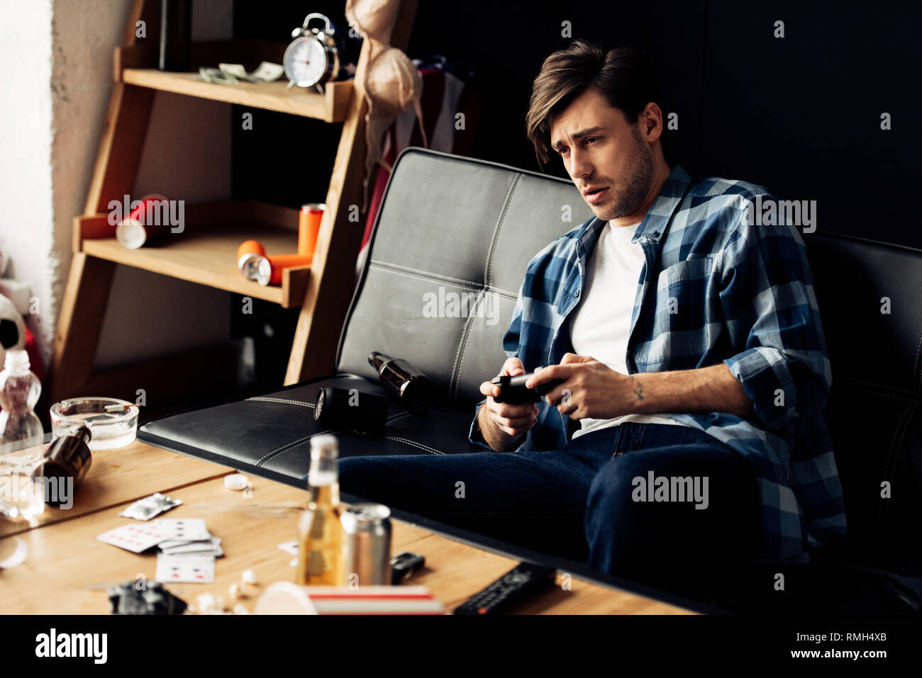 Tired player playing game joystick hi-res stock photography and images ...