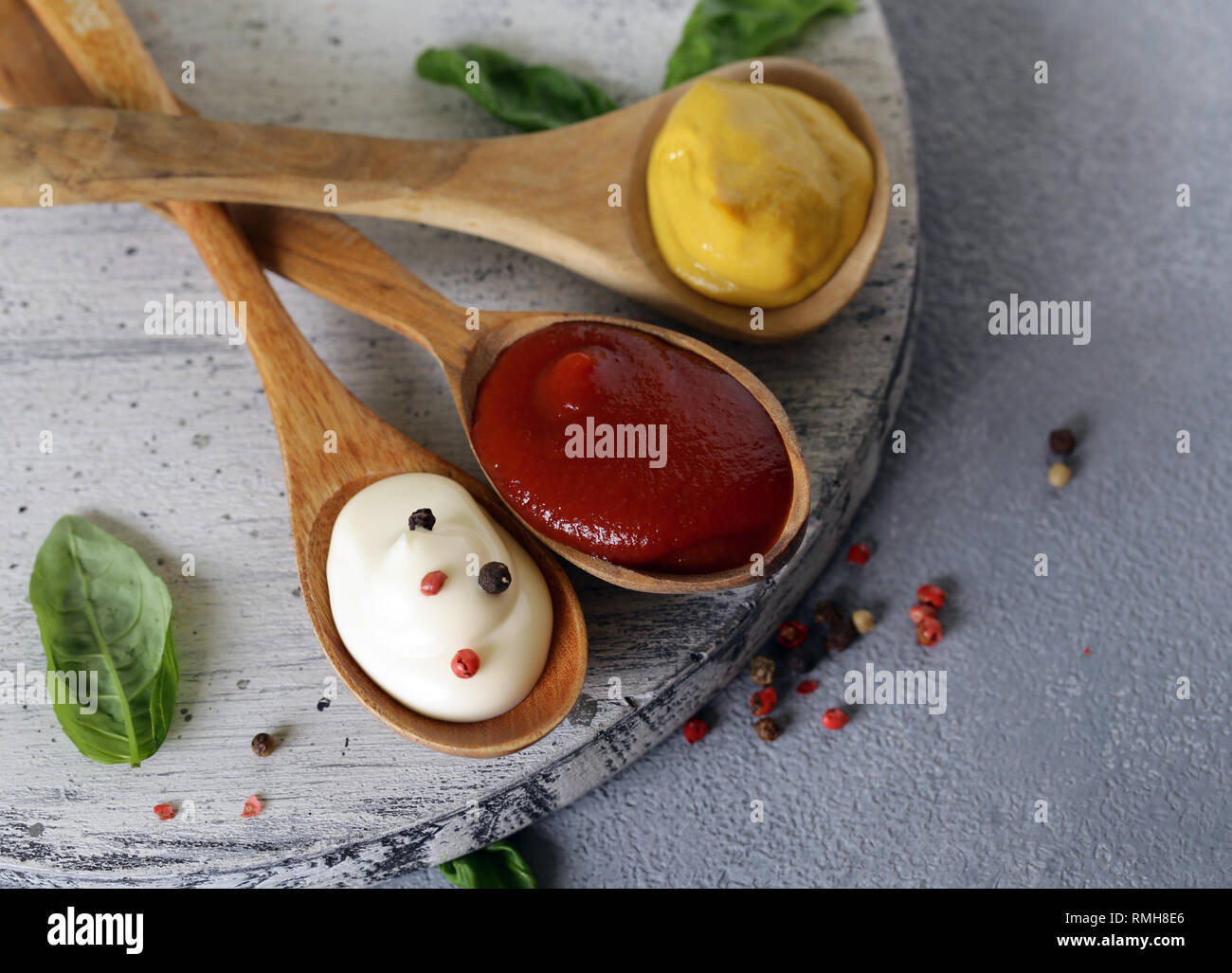 three variants of ketchup, mustard and mayonnaise sauce Stock Photo - Alamy
